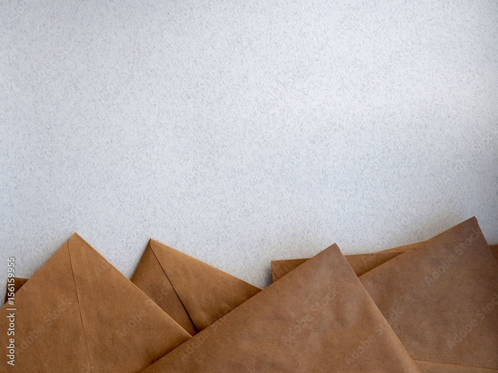 many envelopes from Kraft paper, old paper as a background, in full ...