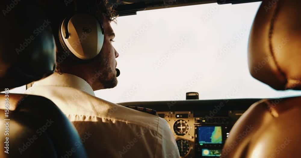 Pilot Flying Small Airplane at Sunrise. POV Cockpit View Stock Video ...