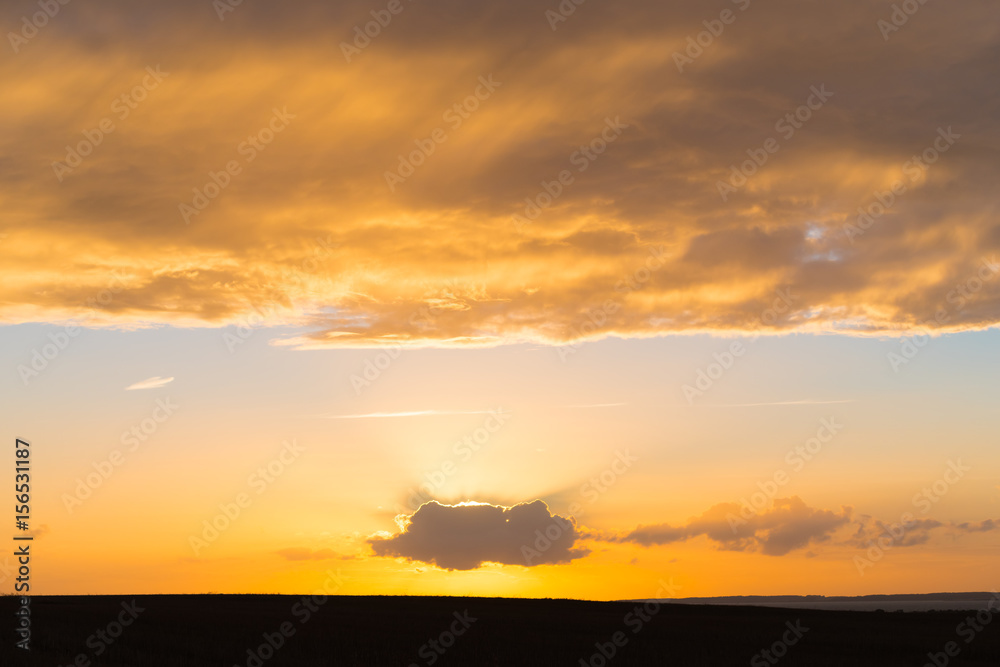Foto Stock beautiful sunset over land | Adobe Stock