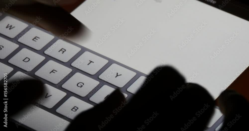 4k Finger operating touch typing email on touchscreen keyboard pad ...