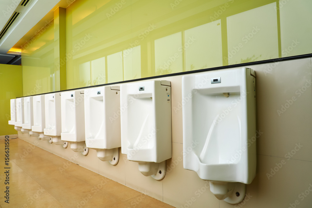 Urinals in public toilet. public restroom for men,modern style Stock ...