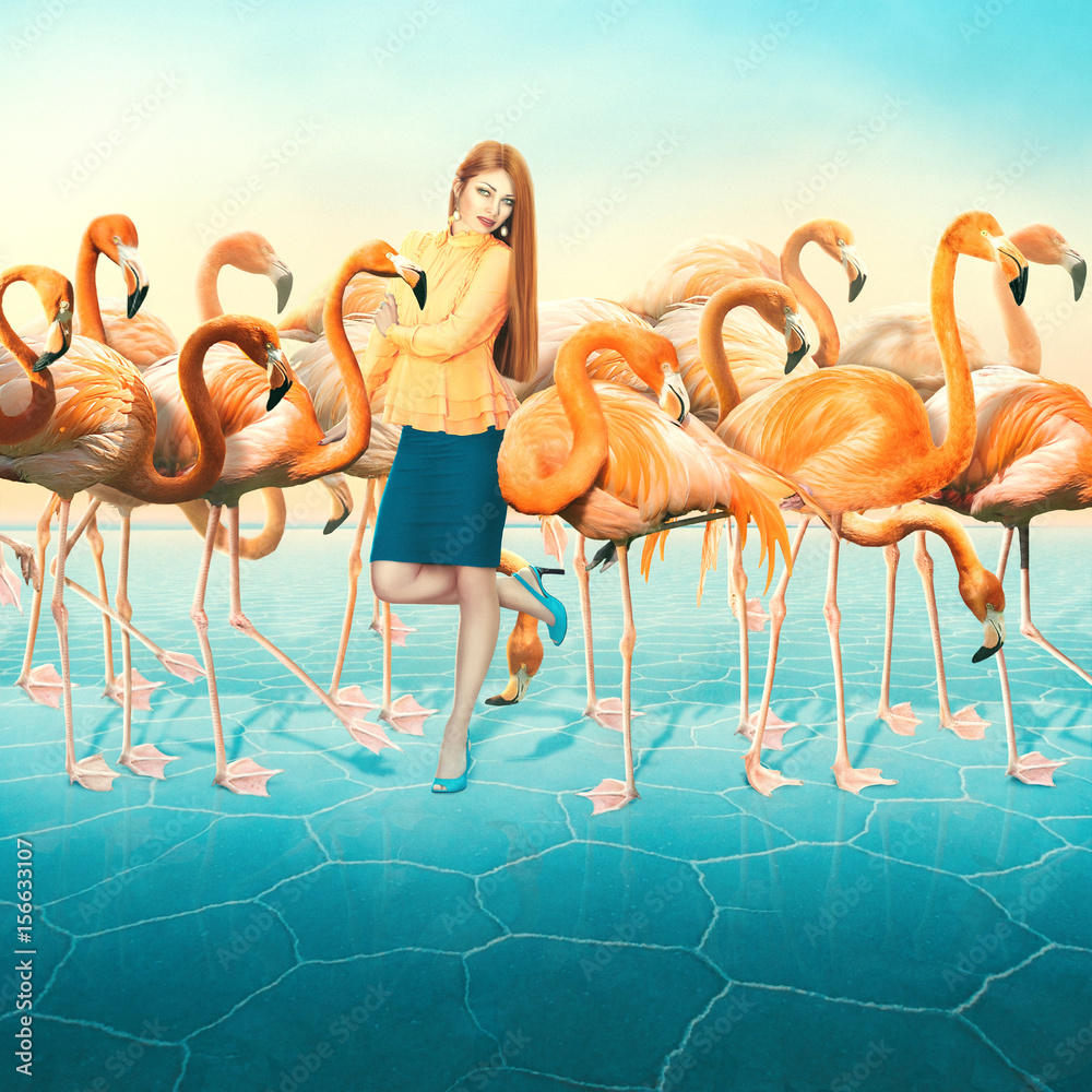 Red Flamingo in desert and elegant dressed up girl with a long hair in ...