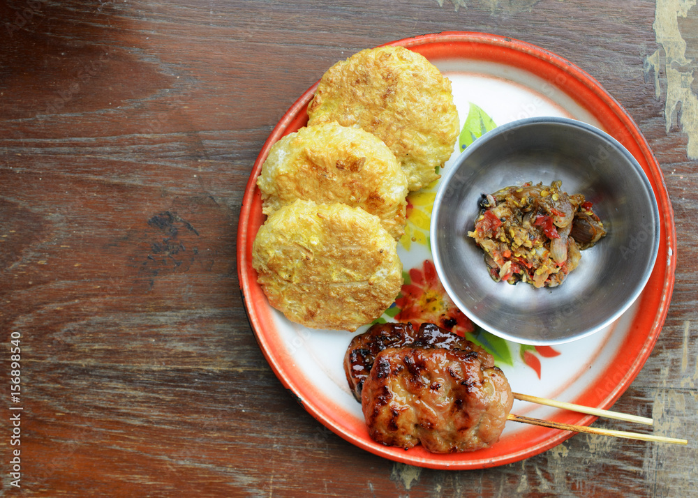 Khao Jee Sticky rice with egg and grilled pork and spicy suace for Thai ...
