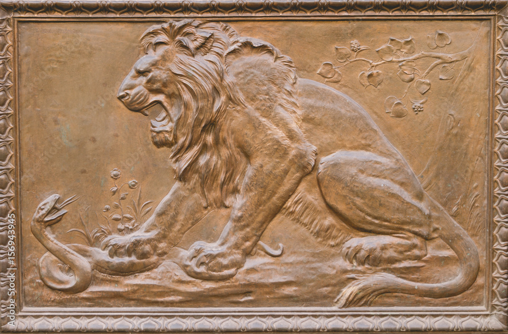 lion and the snake. Ancient chased image Stock Photo | Adobe Stock
