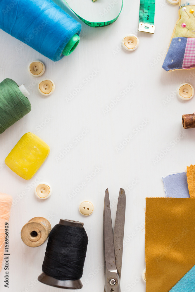 sewing tools, patchwork, tailoring concept - tools on white table ...