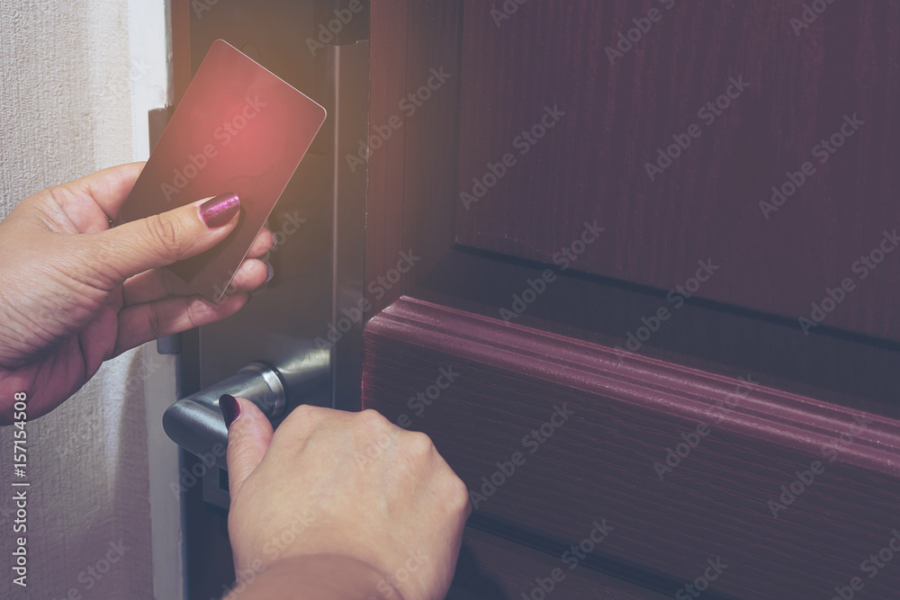 Vintage photo of lady using key card opening door in hotel room Stock ...