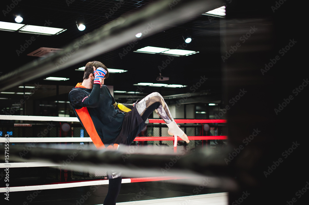 Professional Muay Thai fighter. Male boxer in training sportswear, an ...