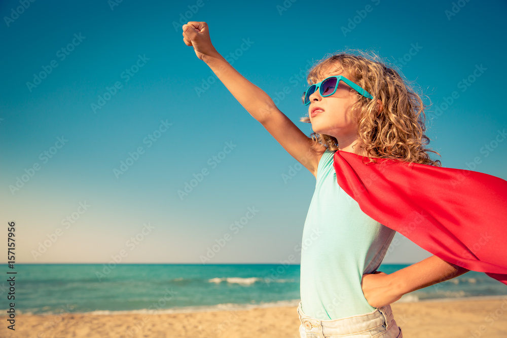 Superhero child on the beach. Summer vacation concept Stock Photo ...