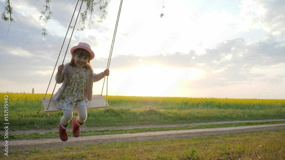 kid swaying nature in forest park, slow motion, Cute little kid girl ...