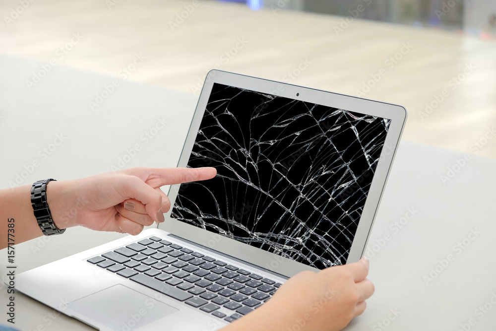 Left finger woman who pointing at screen laptop on damaged Stock Photo ...