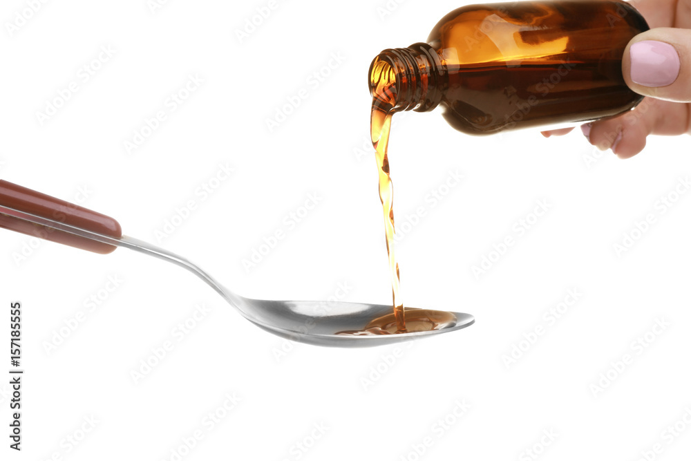 Pouring cough syrup into spoon on white background Stock Photo | Adobe ...