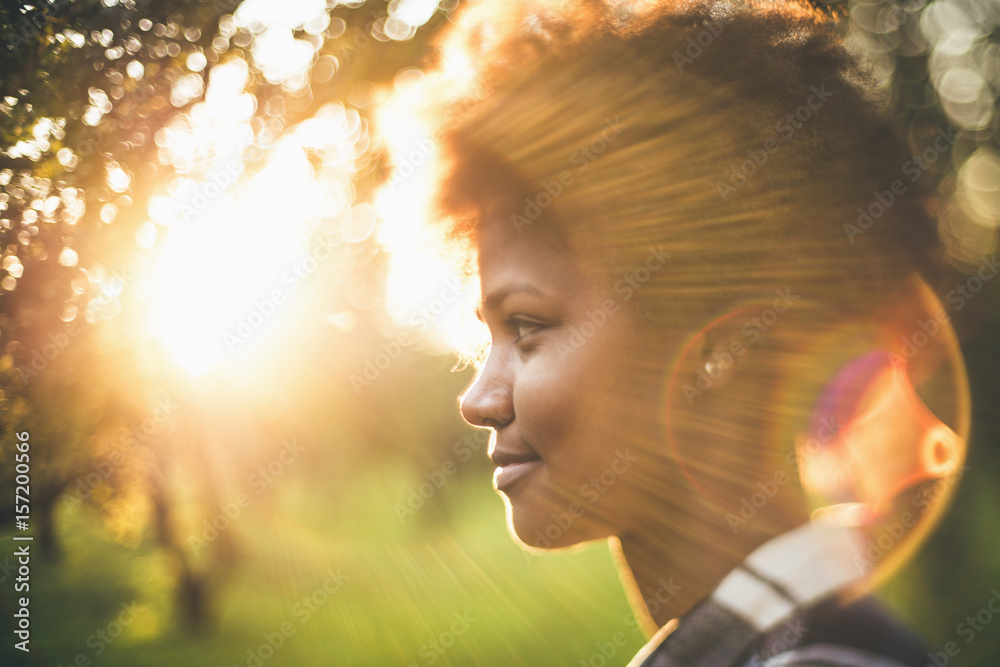 Art tilt-shift portrait of young charming black girl with curly afro ...