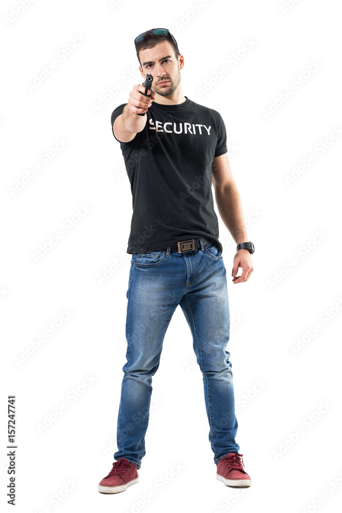 Undercover police man holding gun in one hand pointing at you. Full ...