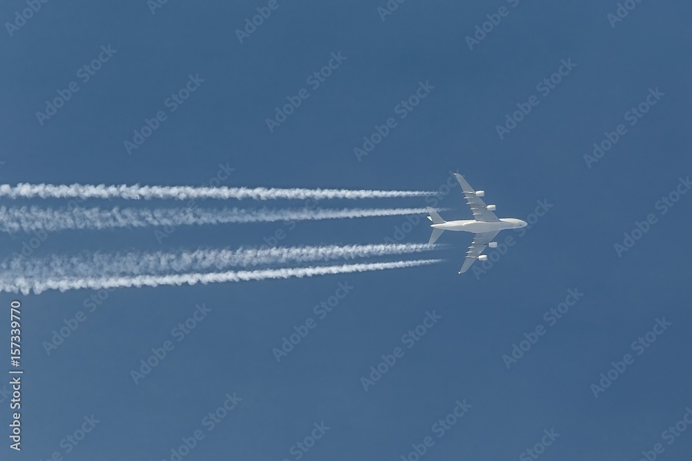 Plane at cruising altitude Stock Photo | Adobe Stock