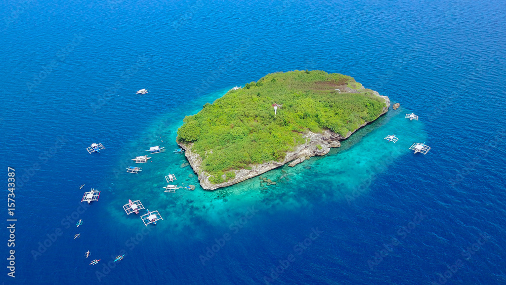 Aerial view of sandy beach with tourists swimming in beautiful clear ...