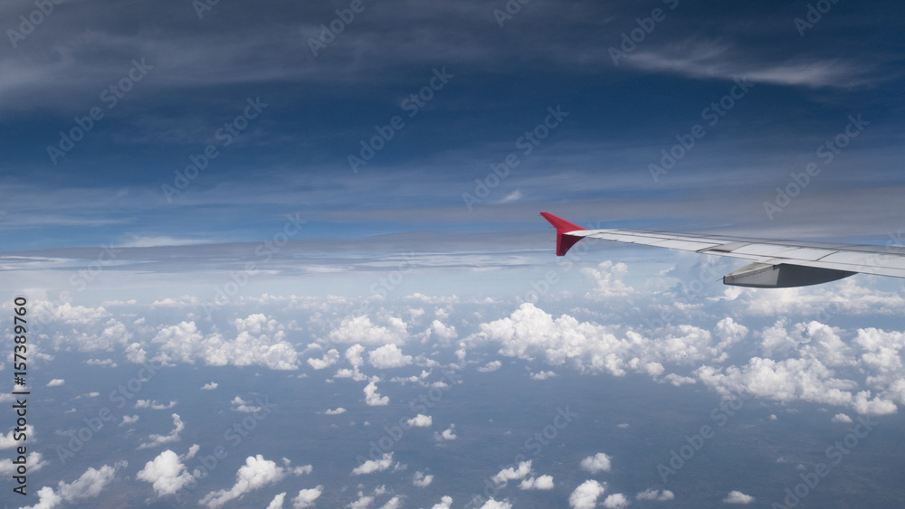 Plane travel concept : View from aircraft window. Clouds and blue sky ...