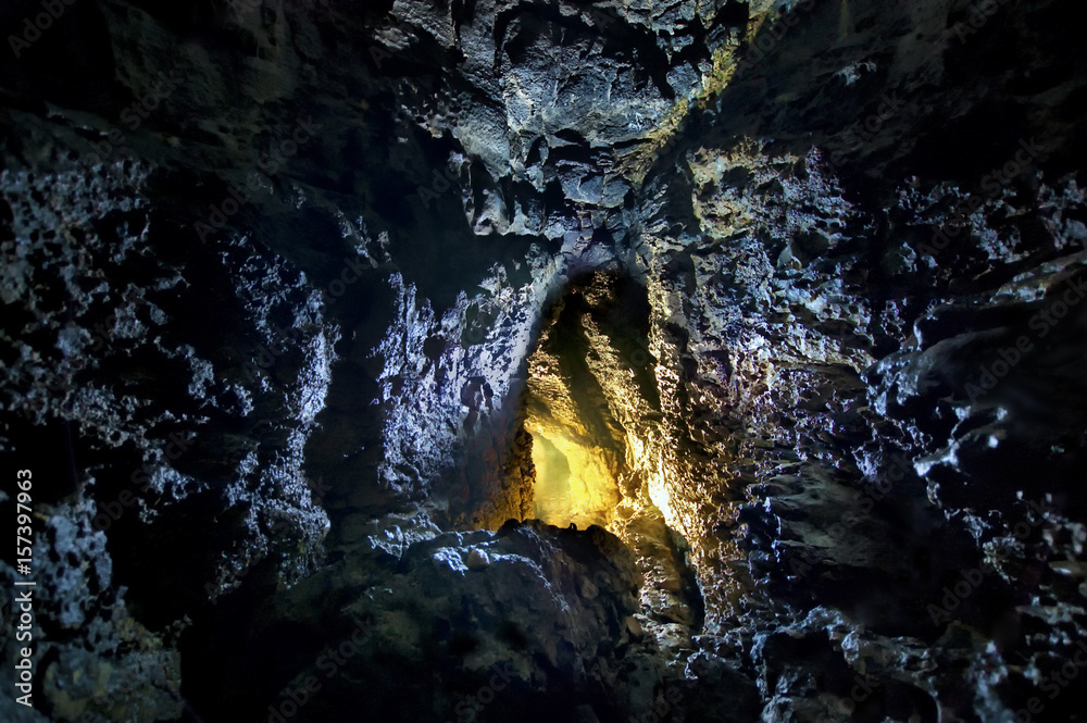 dark cave with light at entrance Stock Photo | Adobe Stock
