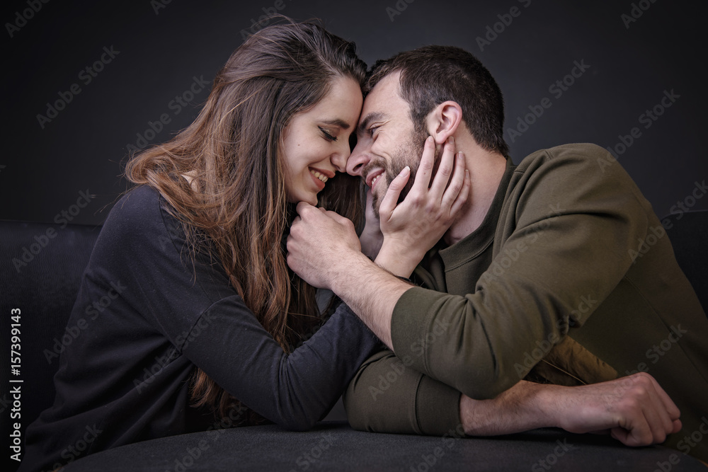Cute young couple in love cuddling and snogging Stock Photo | Adobe Stock