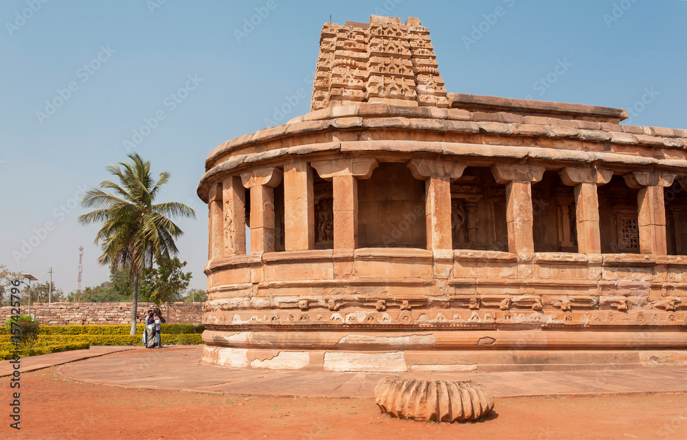 Tourists watching facade of the 7th century Durga temple, famous Hindu ...