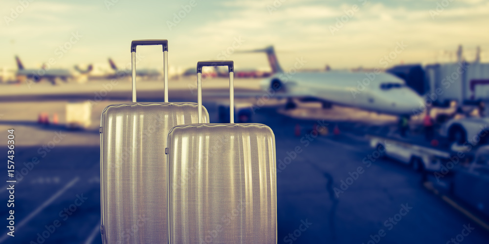 Luxury suitcases in airport terminal waiting area, passenger airplane ...