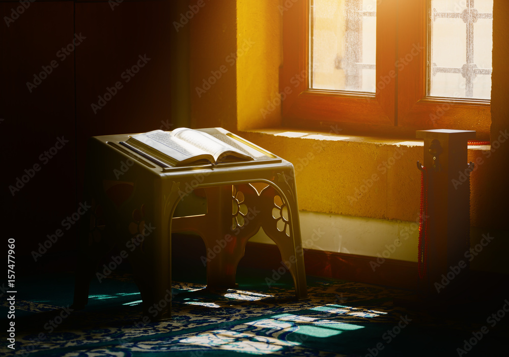 Holy quran under the sunlight in the mosque Stock Photo | Adobe Stock