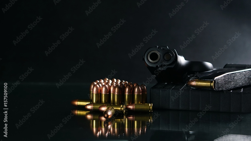 Bullets on the black mirror floor. Bullets are a projectile expelled ...