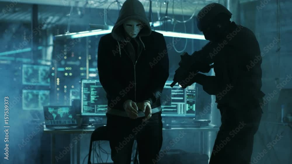 Masked Hacker Wearing Handcuffs is Guarded by Fully Armed Special ...