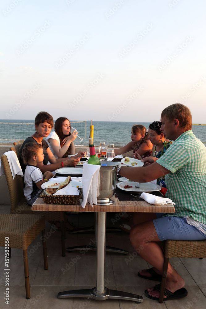 Family in the beach restaurant Stock Photo | Adobe Stock