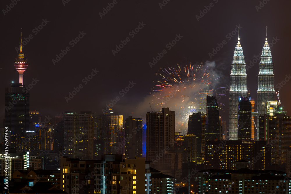 Fireworks explode near Malaysia's landmark Petronas Twin Towers during ...
