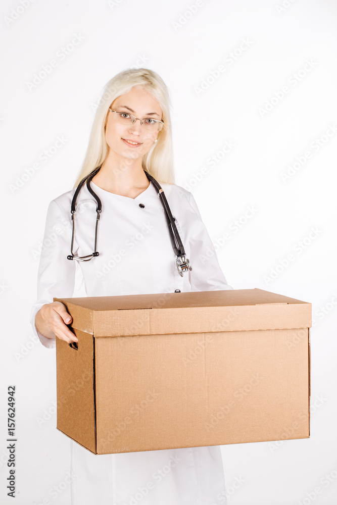 doctor smiling, holding box and looking at camera. image on a white ...