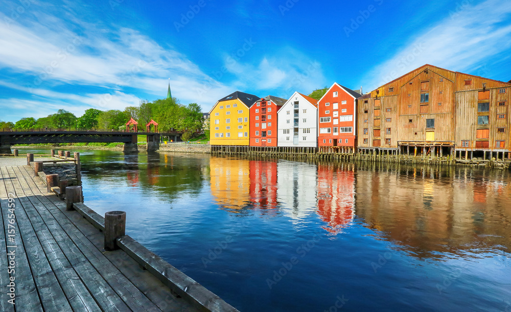The view of the old timber buildings located along the river Nidelva in ...