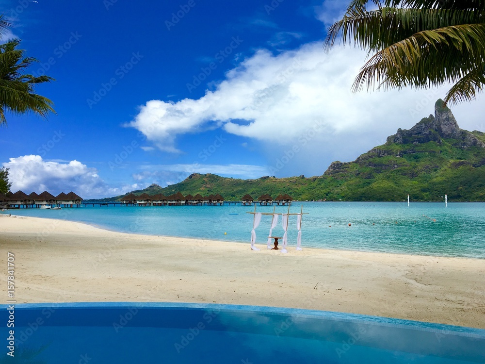 Beautiful turquoise lagoon of Bora Bora and the overwater bungalows of ...