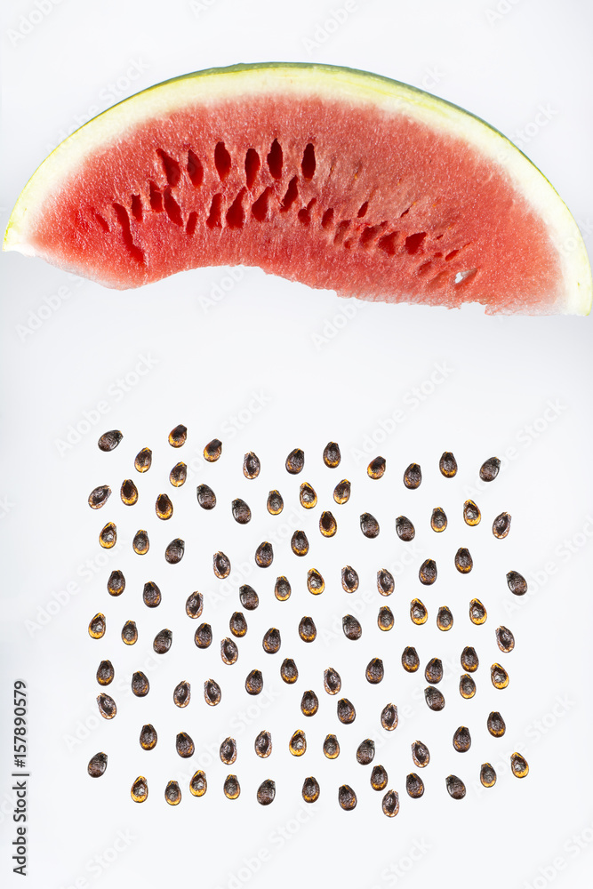 Raining seeds. Beautifully cut watermelon slice. Watermelon on white ...