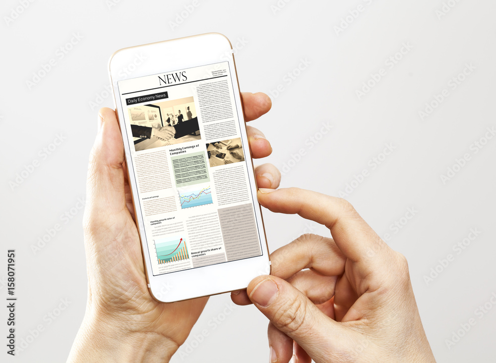 Woman hand reading newspaper on mobile phone Stock Photo | Adobe Stock