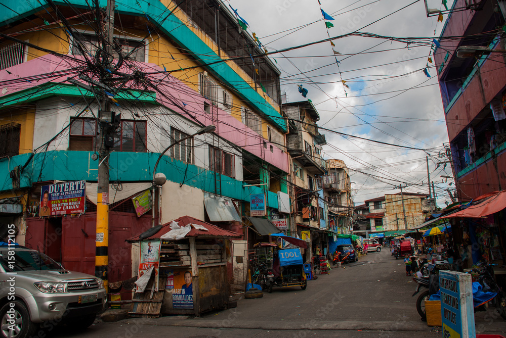 Local street with houses in the Philippines capital Manila Stock Photo ...