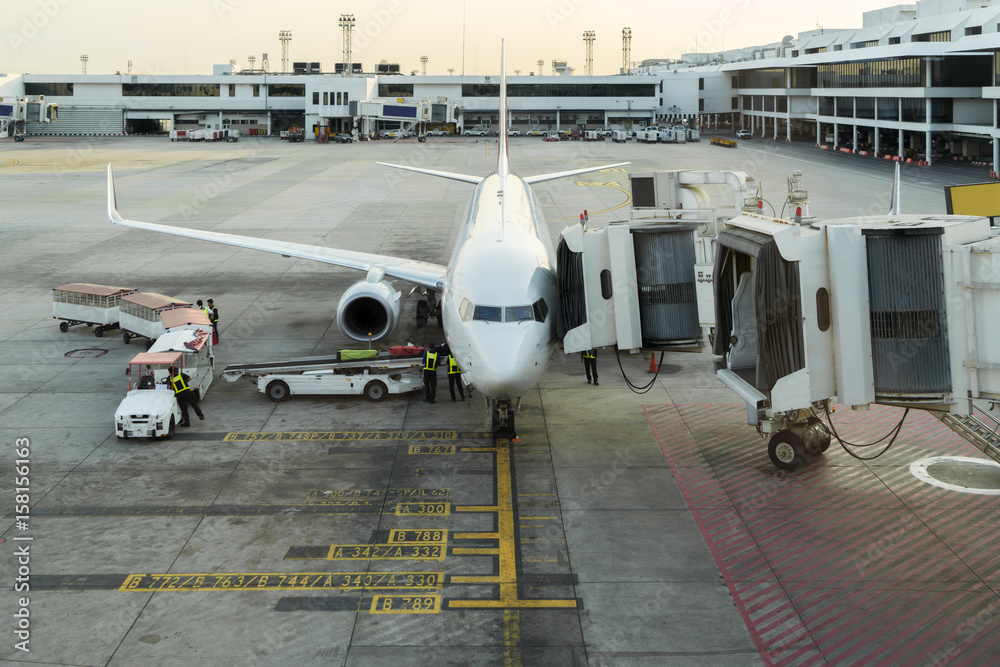 Airplane at airport terminal gate ready for takeoff. Modern ...