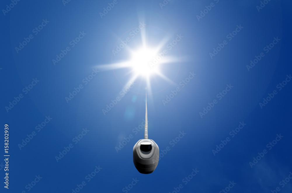 Renewable energy, illustrated by lamp switch connected to the sun in ...