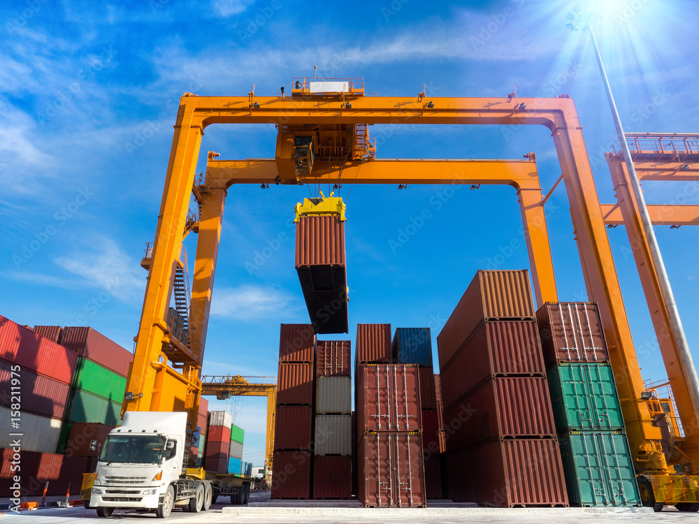 The RTG(Rubber Tried Gantry Cranes) pick up full loaded containers on ...