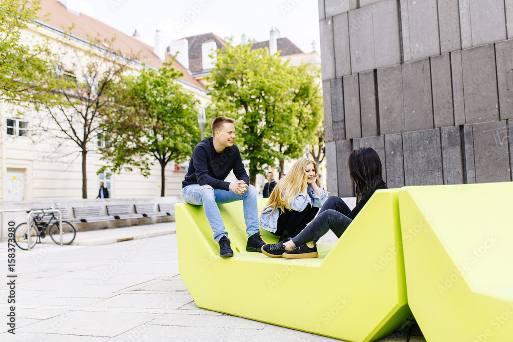 Young people sitting on the lounge seats in Vienna Stock Photo | Adobe ...