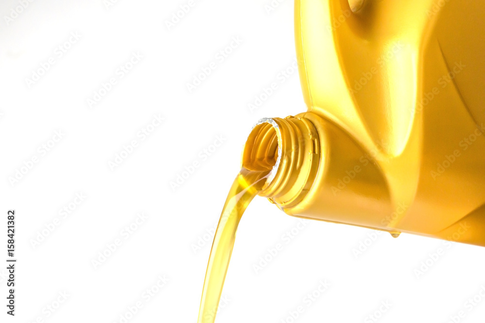 Pouring oil lubricant motor car from bottle on isolated white background Stock Photo | Adobe Stock
