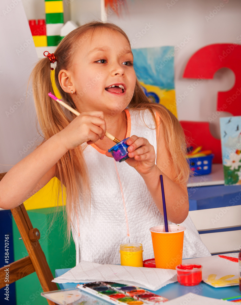 Small students painting in art school class. Child drawing by paints on ...