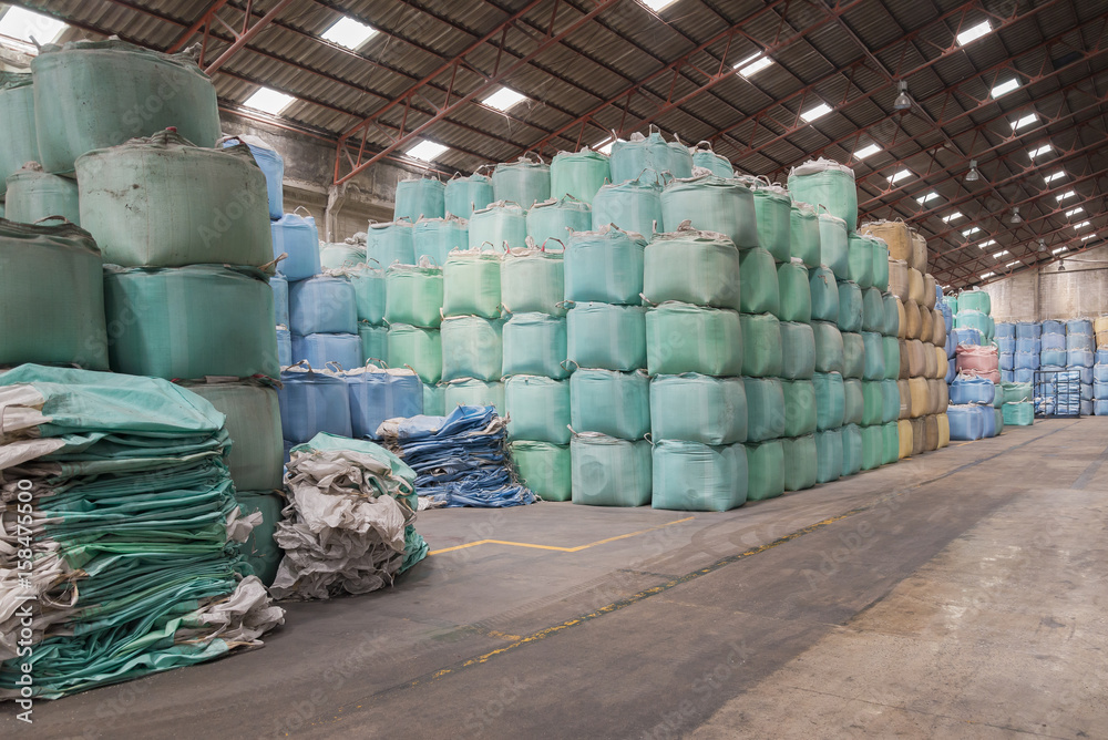 Big bags stack that contain the rice in warehouse Stock Photo | Adobe Stock