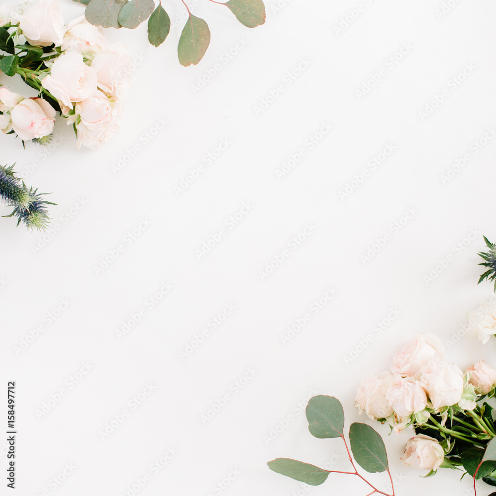 Border frame made of beige rose flowers, eringium flower, eucalyptus ...