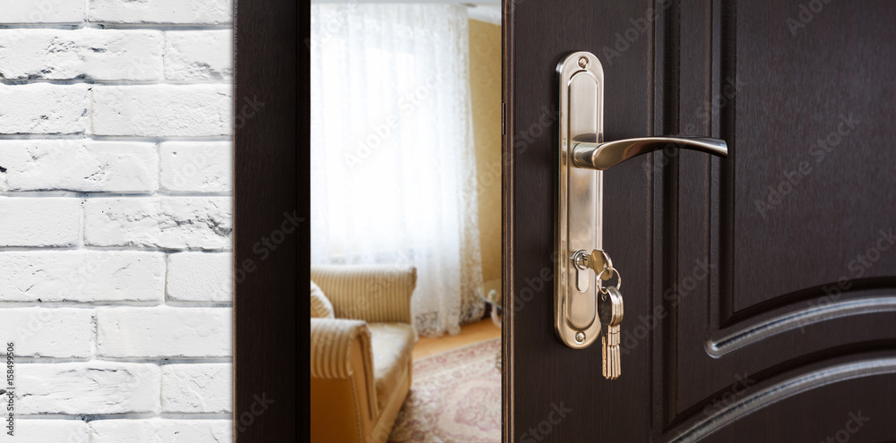 Half open door of a modern living room closeup. Stock Photo | Adobe Stock