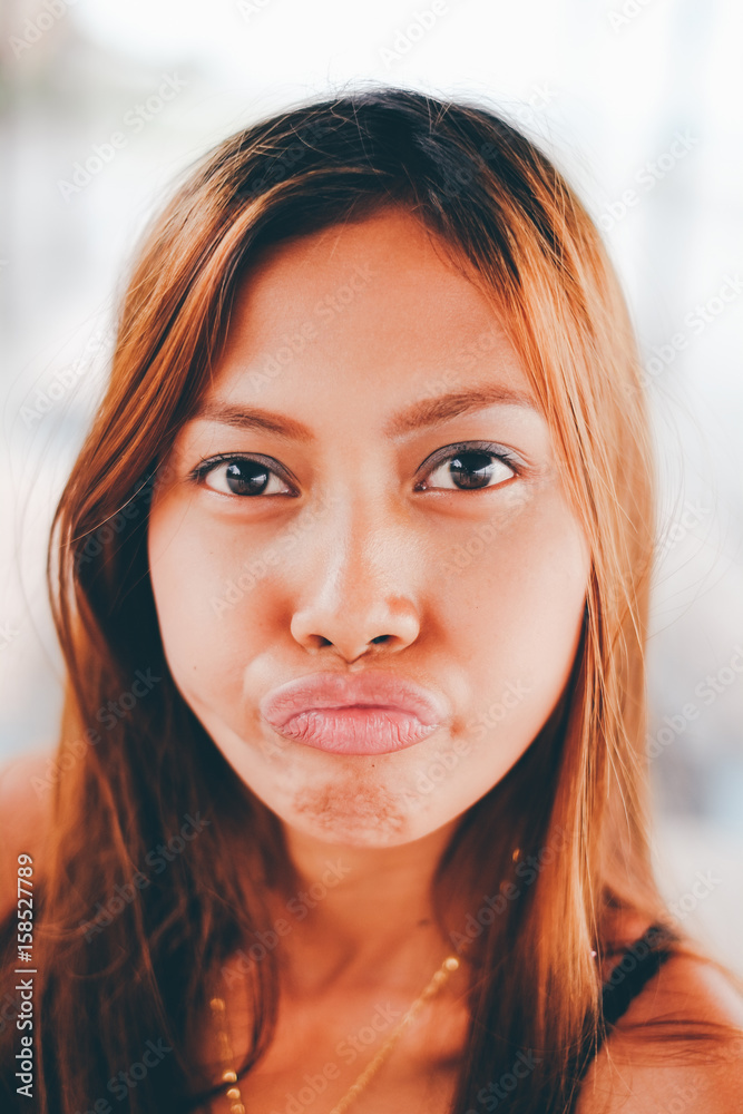 Portrait of a girl with the funny face expression Stock Photo | Adobe Stock