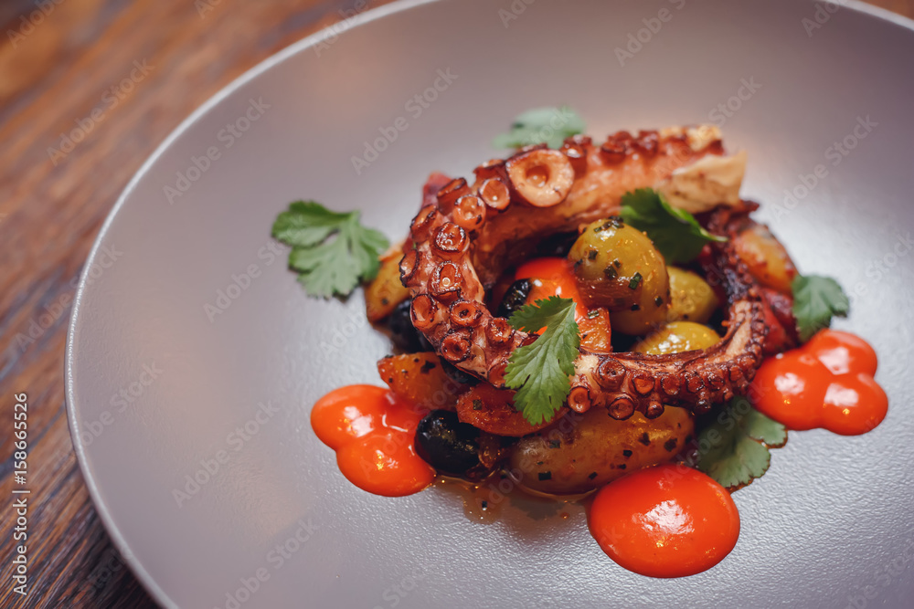The process of eating the delicious grilled octopus. jukkumi bokkeum is ...
