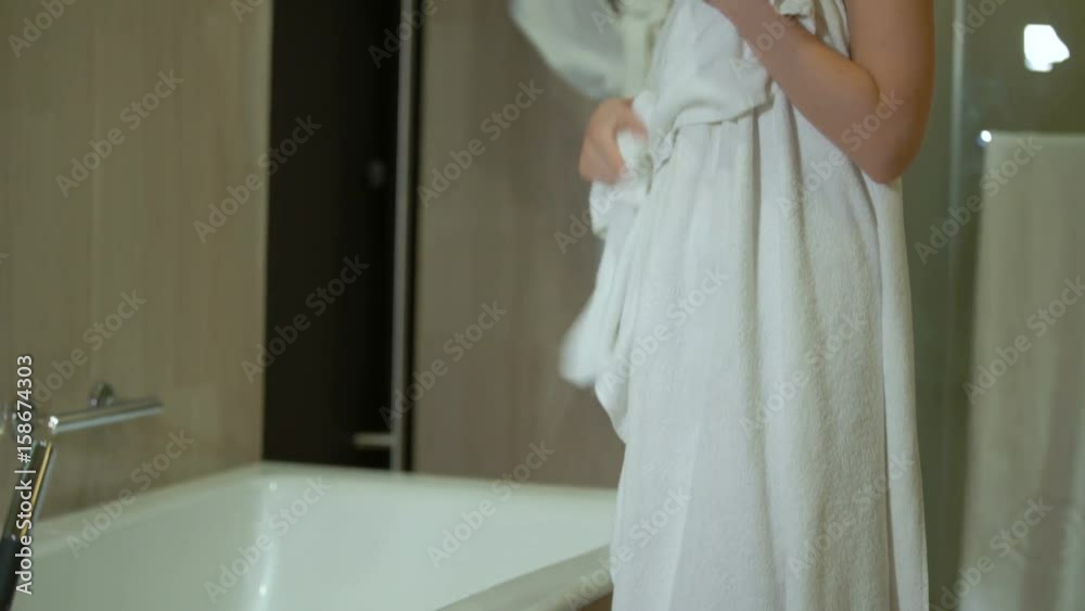 Naked Woman Is Wiping Legs With Towel After Taking Shower Nude
