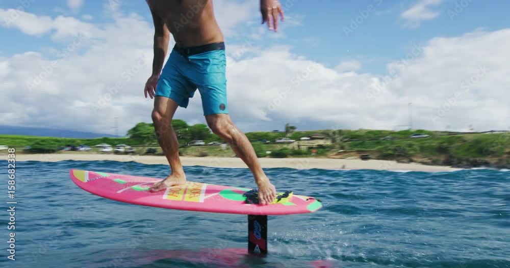 Surfer on hydrofoil surfboard riding blue ocean wave. Futuristic ...