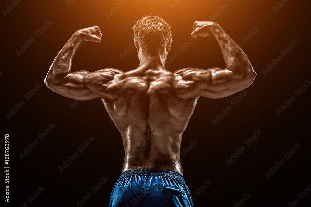 Strong Athletic Man Fitness Model posing back muscles, triceps o Stock ...