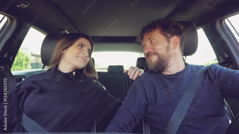 Couple in love kissing in car while driving Stock Video | Adobe Stock